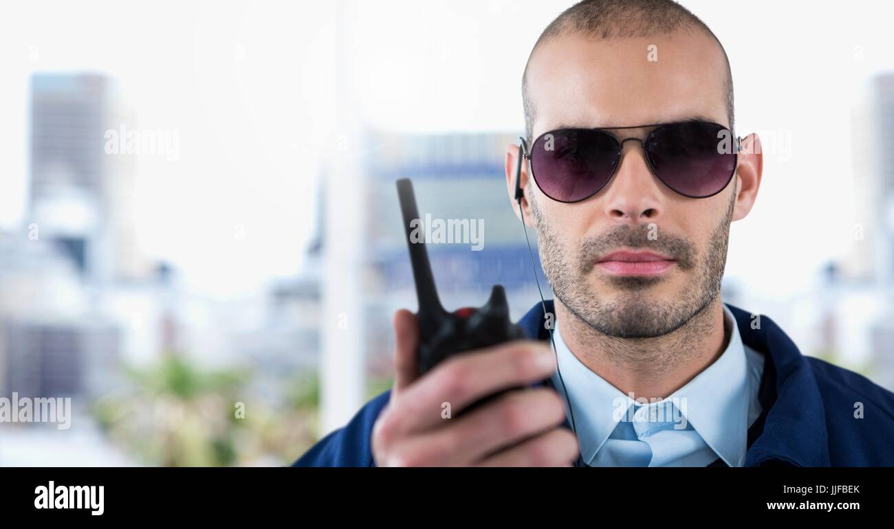 Digital composite of Security man in city Stock Photo - Alamy