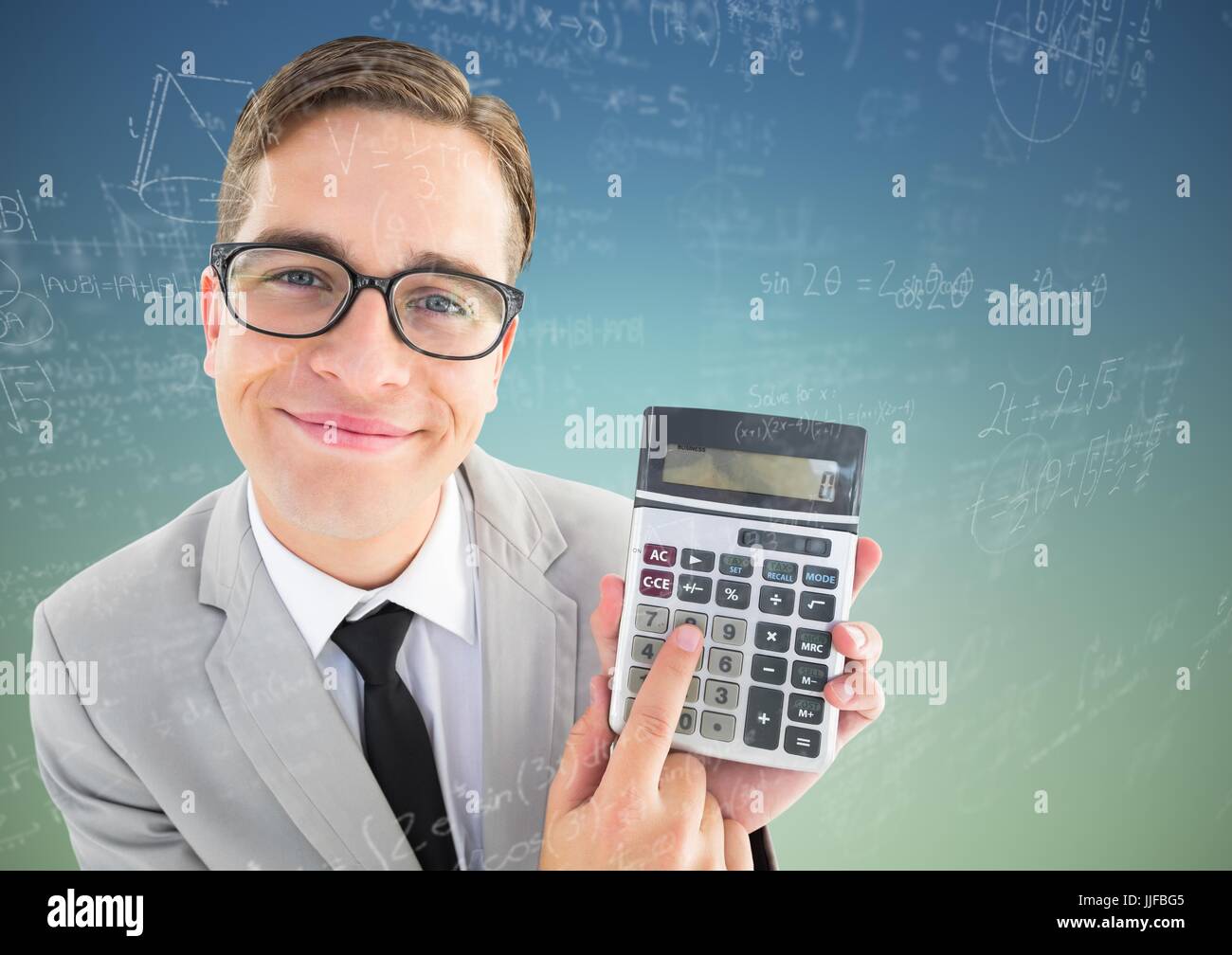 Digital composite of Man looking up with calculator and math doodles ...