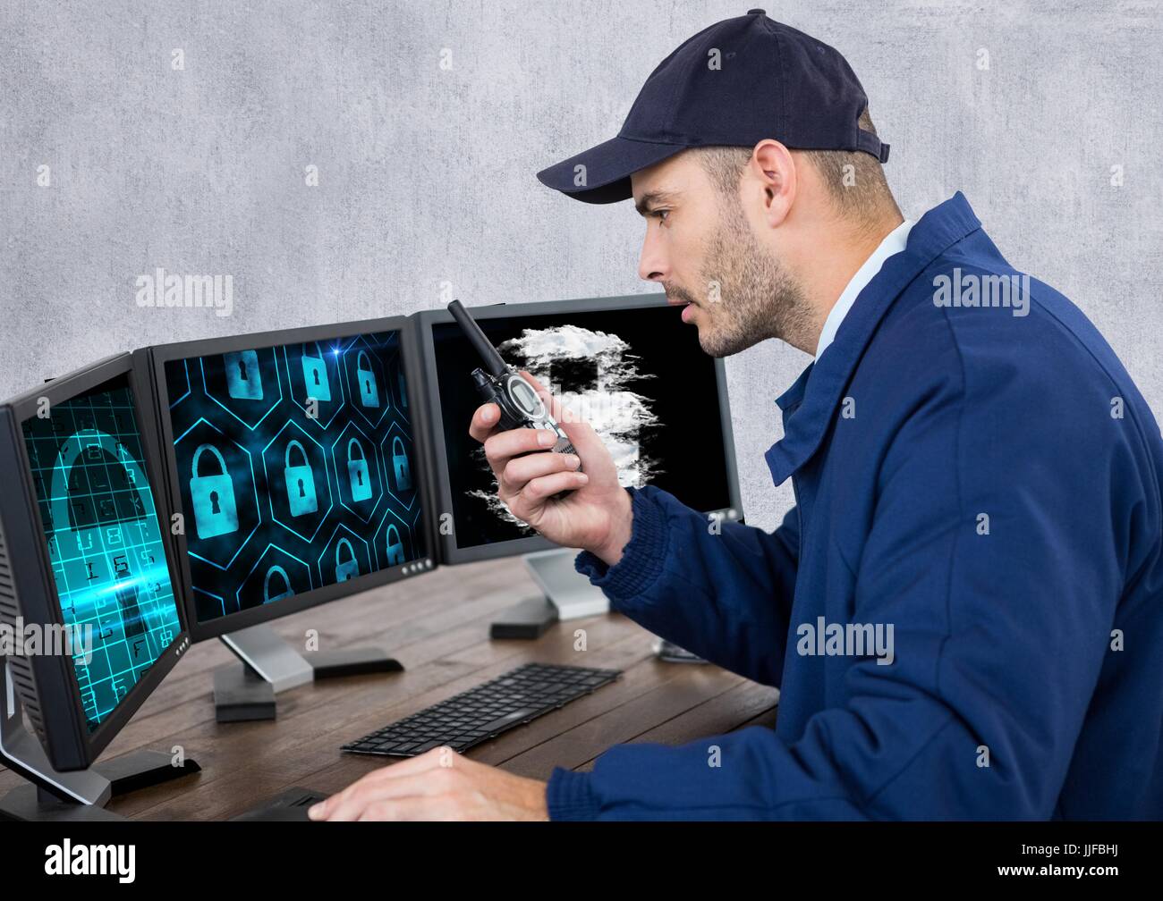 Digital composite of security guard with locks on the screens speaking ...