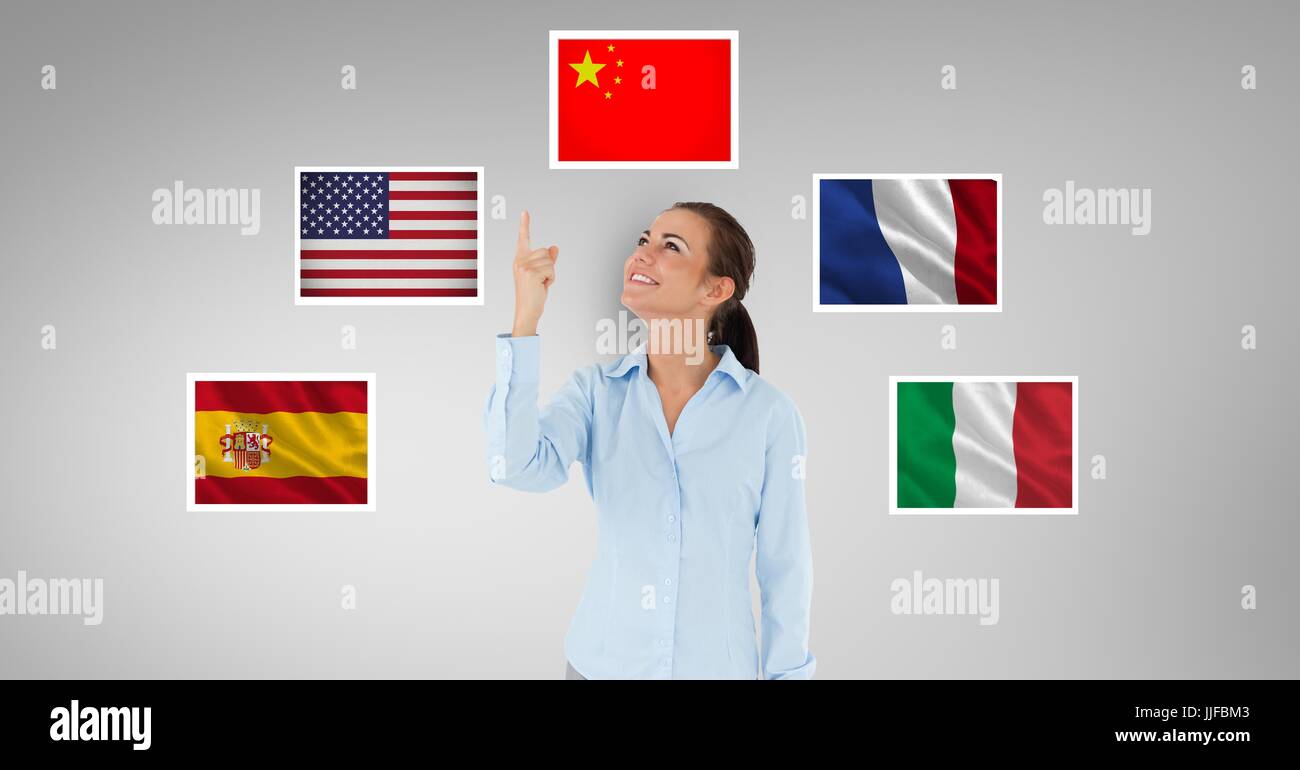 Digital composite of Smiling businesswoman pointing upwards standing by ...