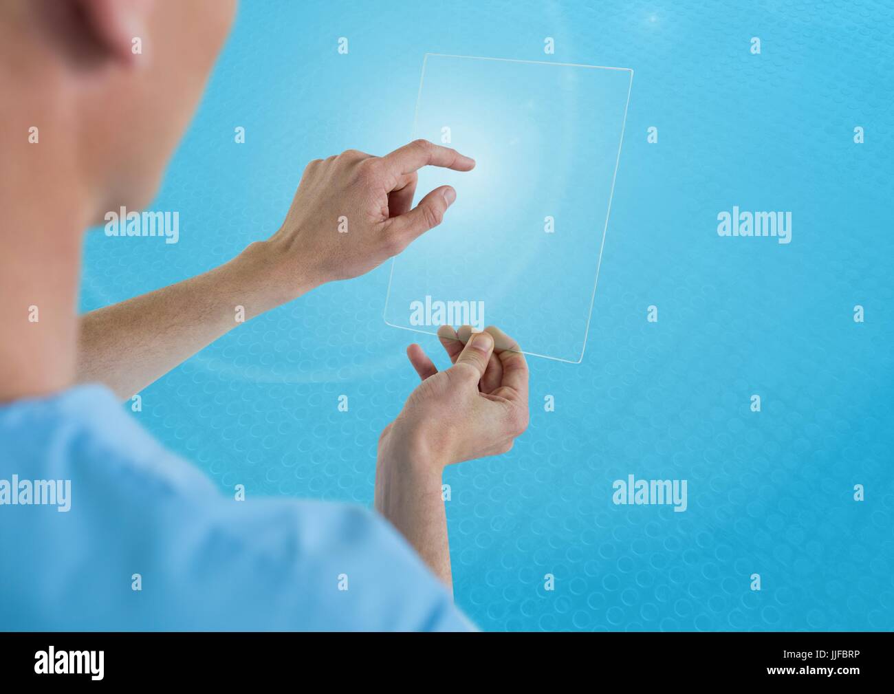 Digital composite of Doctor holding glass tablet and blue background ...