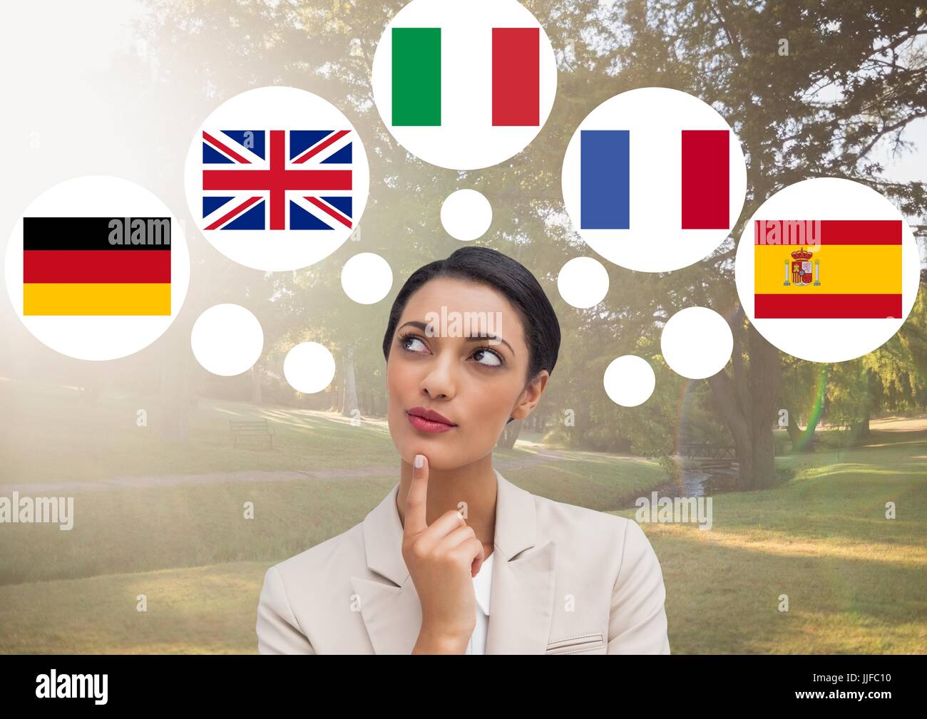 Digital composite of woman thinking in main languages in the park Stock ...