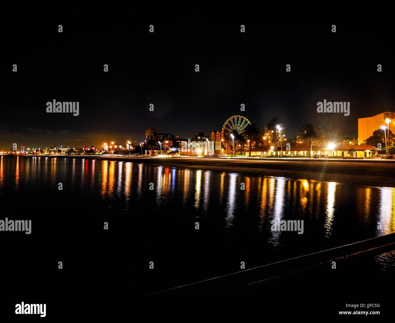A beach waterfront at night Stock Photo - Alamy