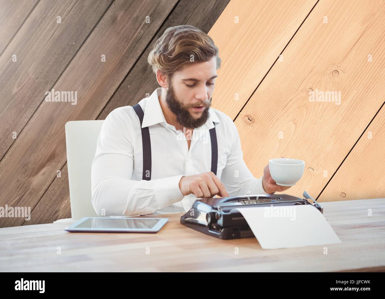 Digital composite of Hipster man on typewriter with wood Stock Photo ...