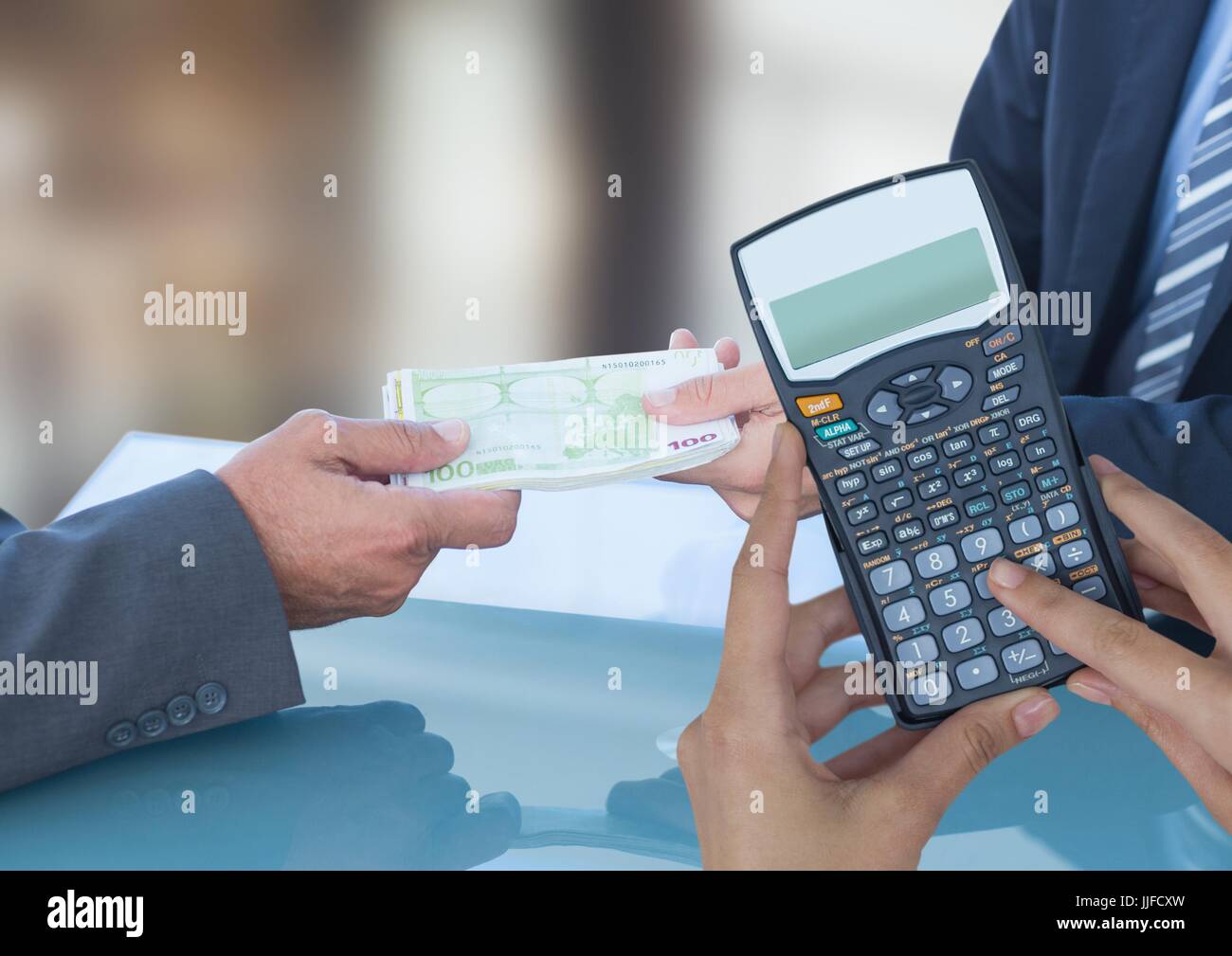 Digital composite of Cropped image of hands using calculator against ...