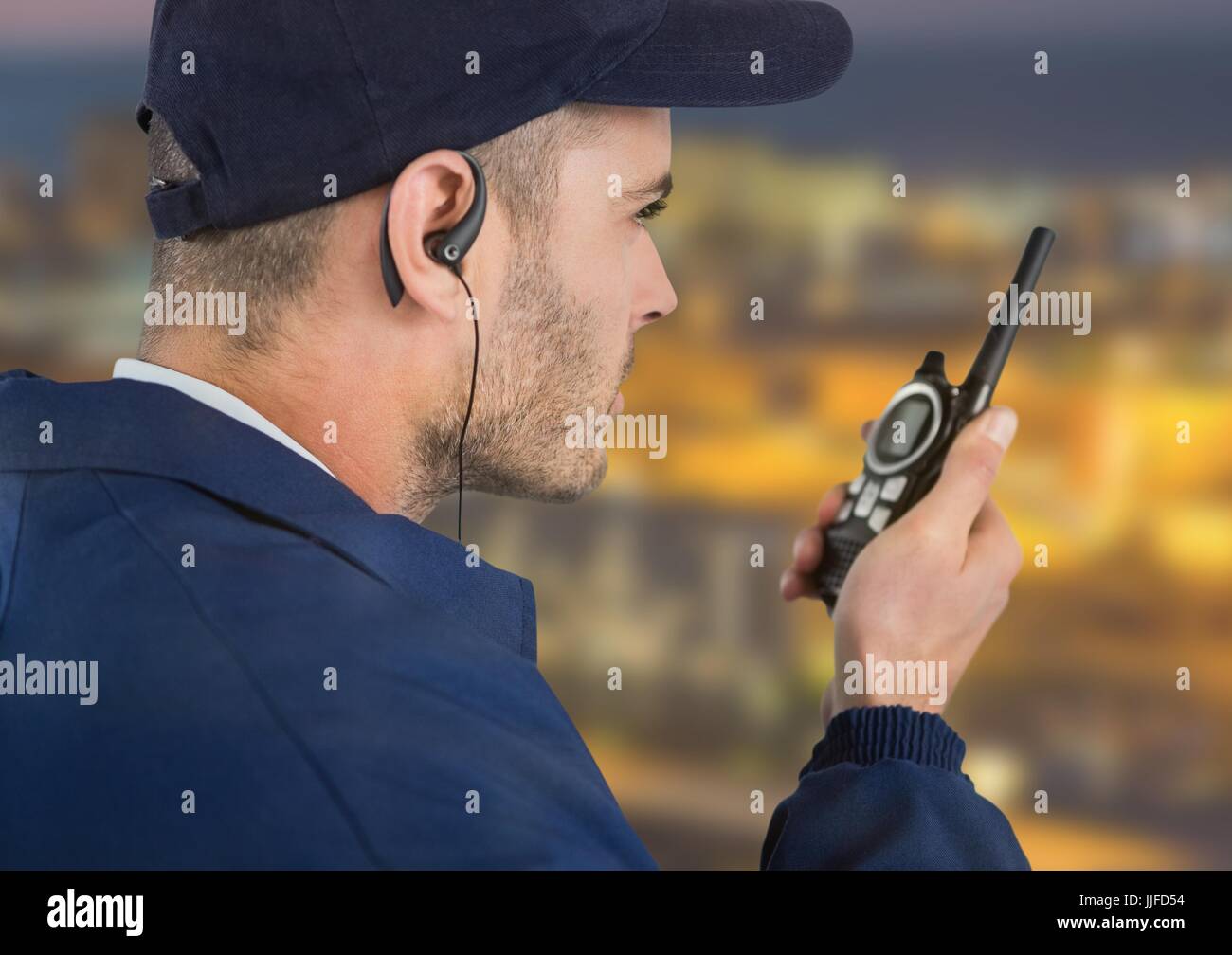 Digital composite of security guard with headphone and walkie-talkie ...