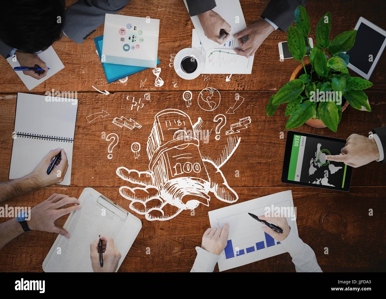 Digital composite of Overhead of hands writing with wood panel and ...