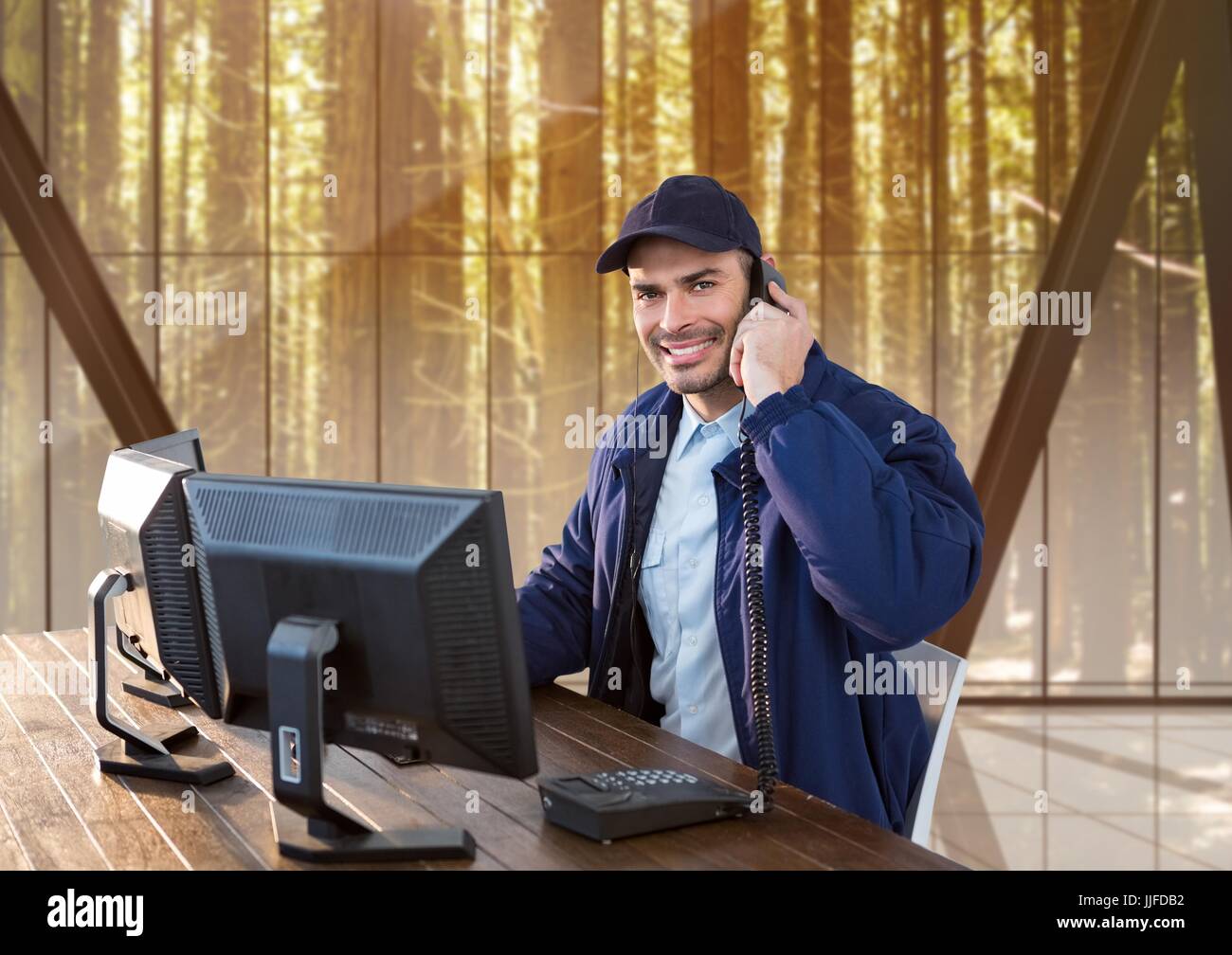 Digital composite security guard who is sitting his office hi-res stock ...