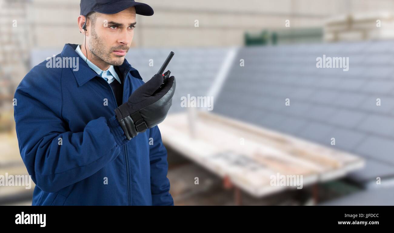 Digital composite of Security man on rooftop building site Stock Photo ...