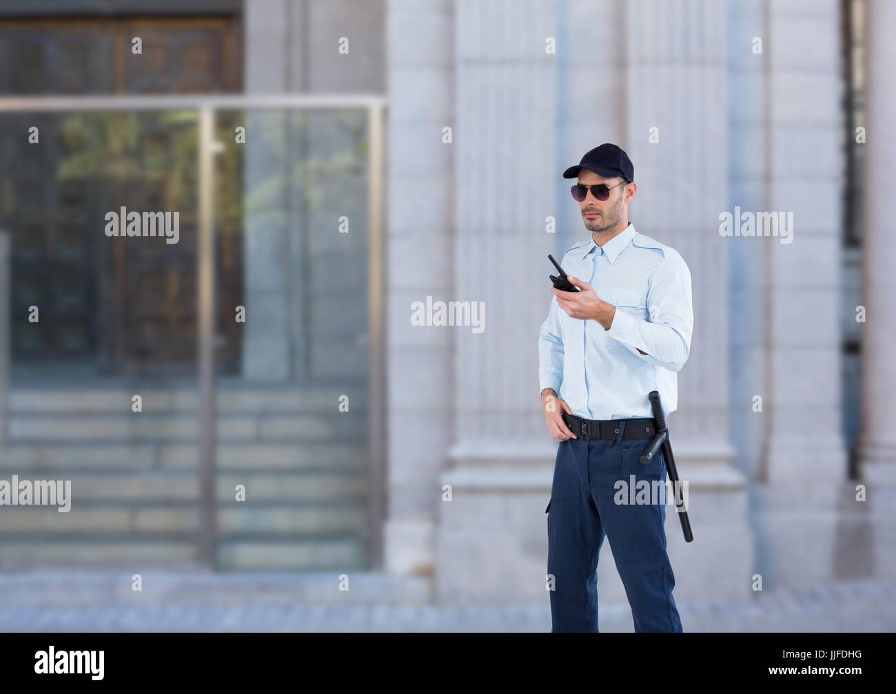 Digital composite of security guard with sun glasses and walkie-talkie ...