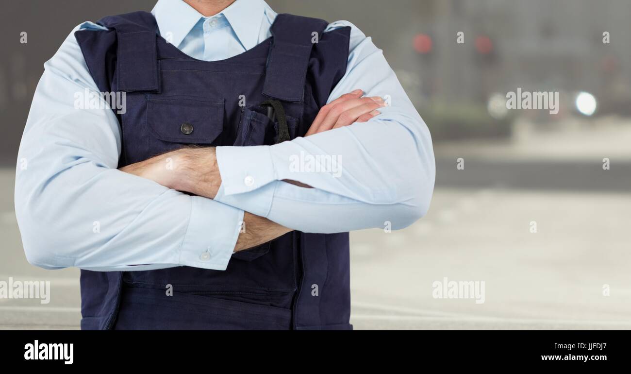 Digital composite of Security guard mid section arms folded against ...
