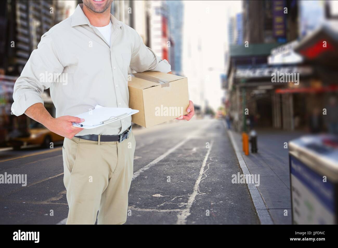 Digital composite of delivery man in city Stock Photo - Alamy