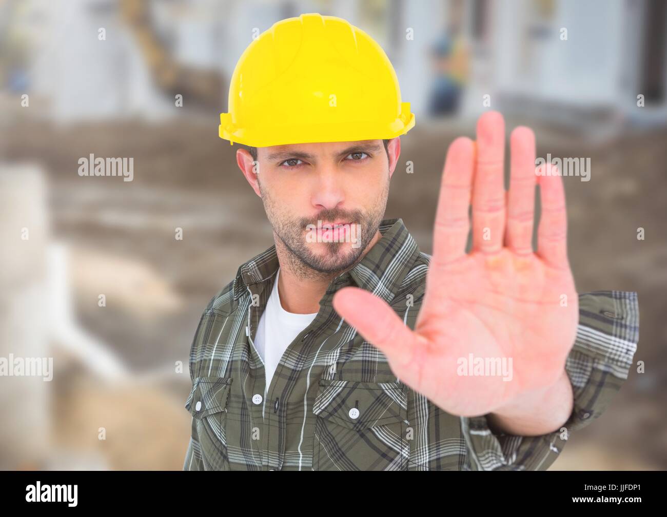 Digital composite of Construction Worker with stop hand gesture in ...