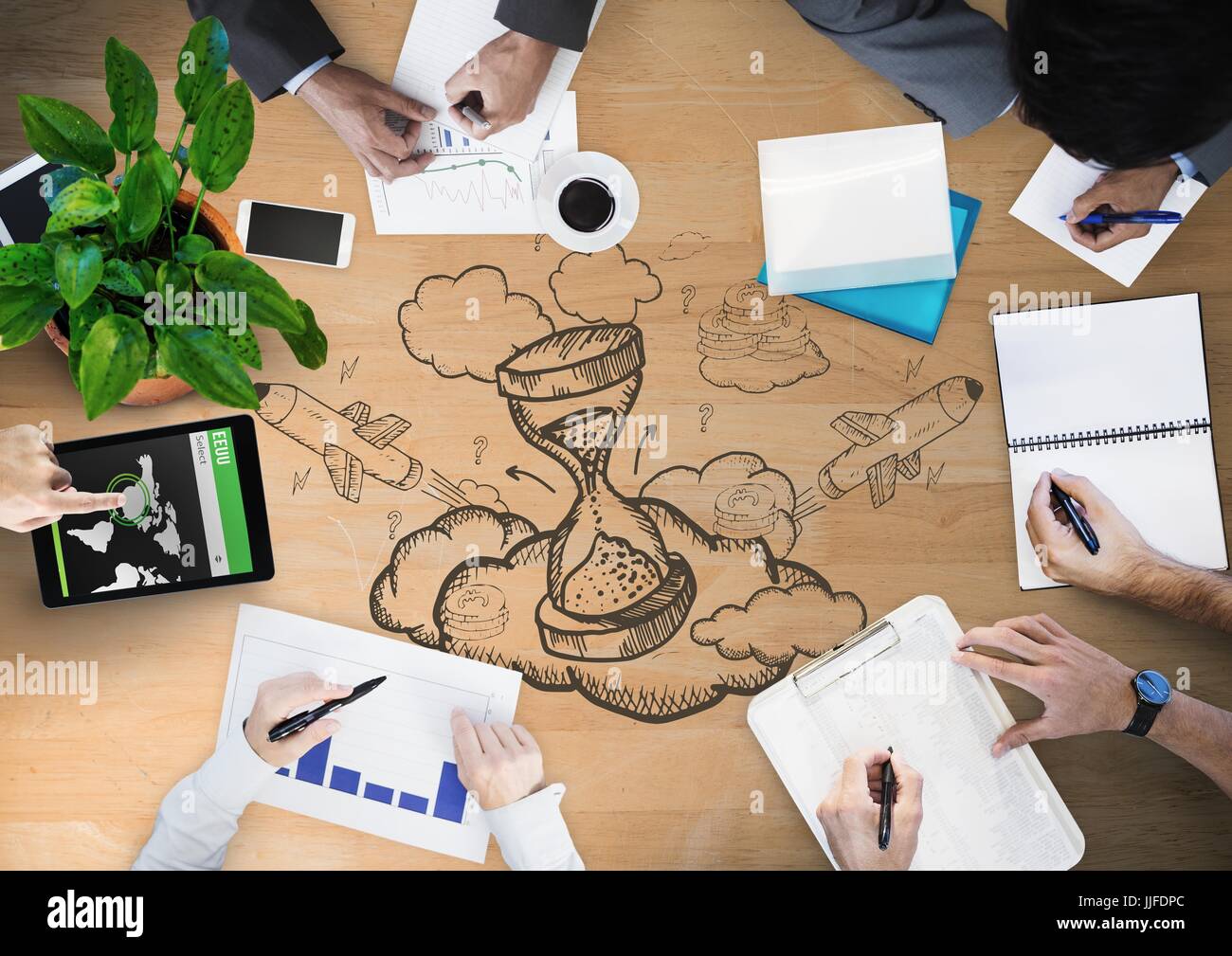 Digital composite of Overhead of hands writing with wood panel and ...