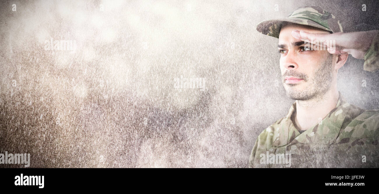 Close up of confident soldier saluting against dark background Stock ...