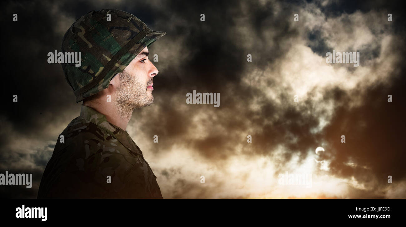 Side view of confident soldier in uniform standing against full frame ...