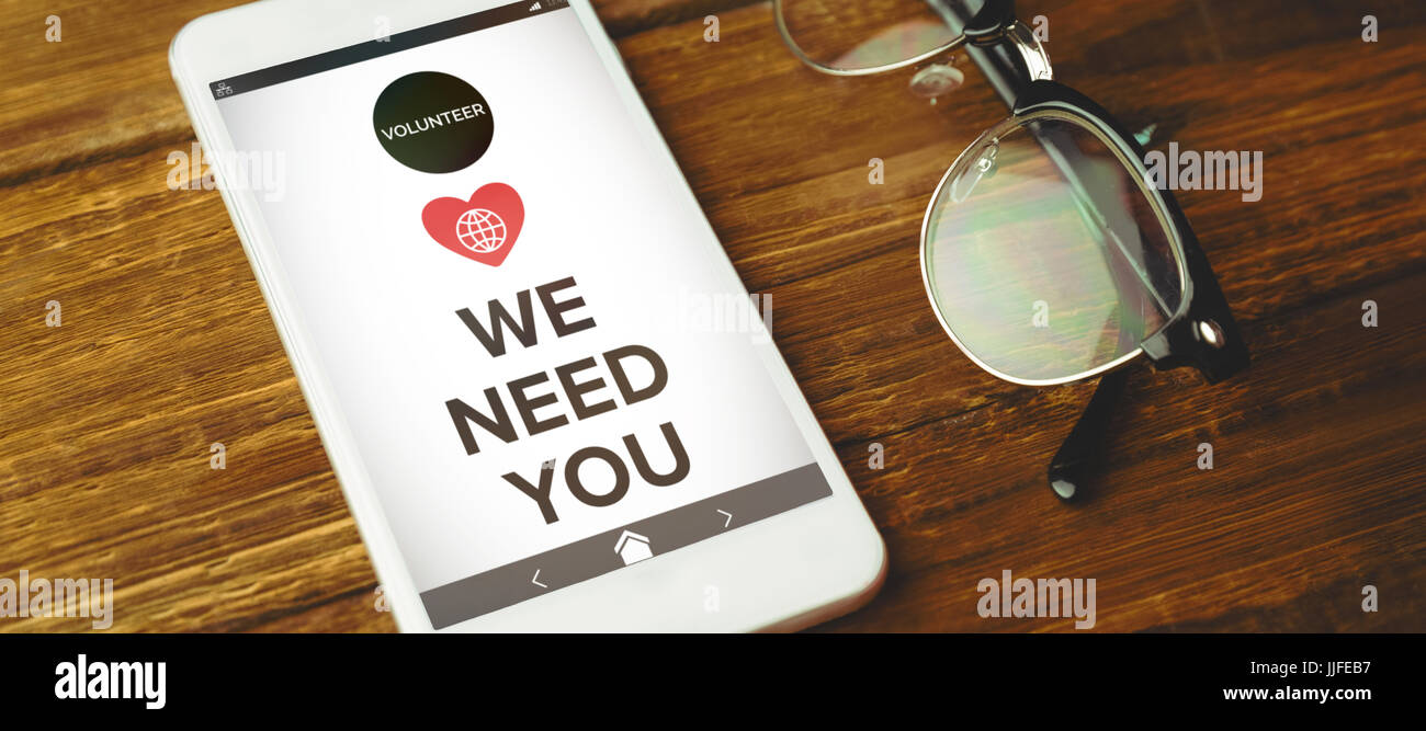 Vector image of We Need You text with icons against high angle view of ...