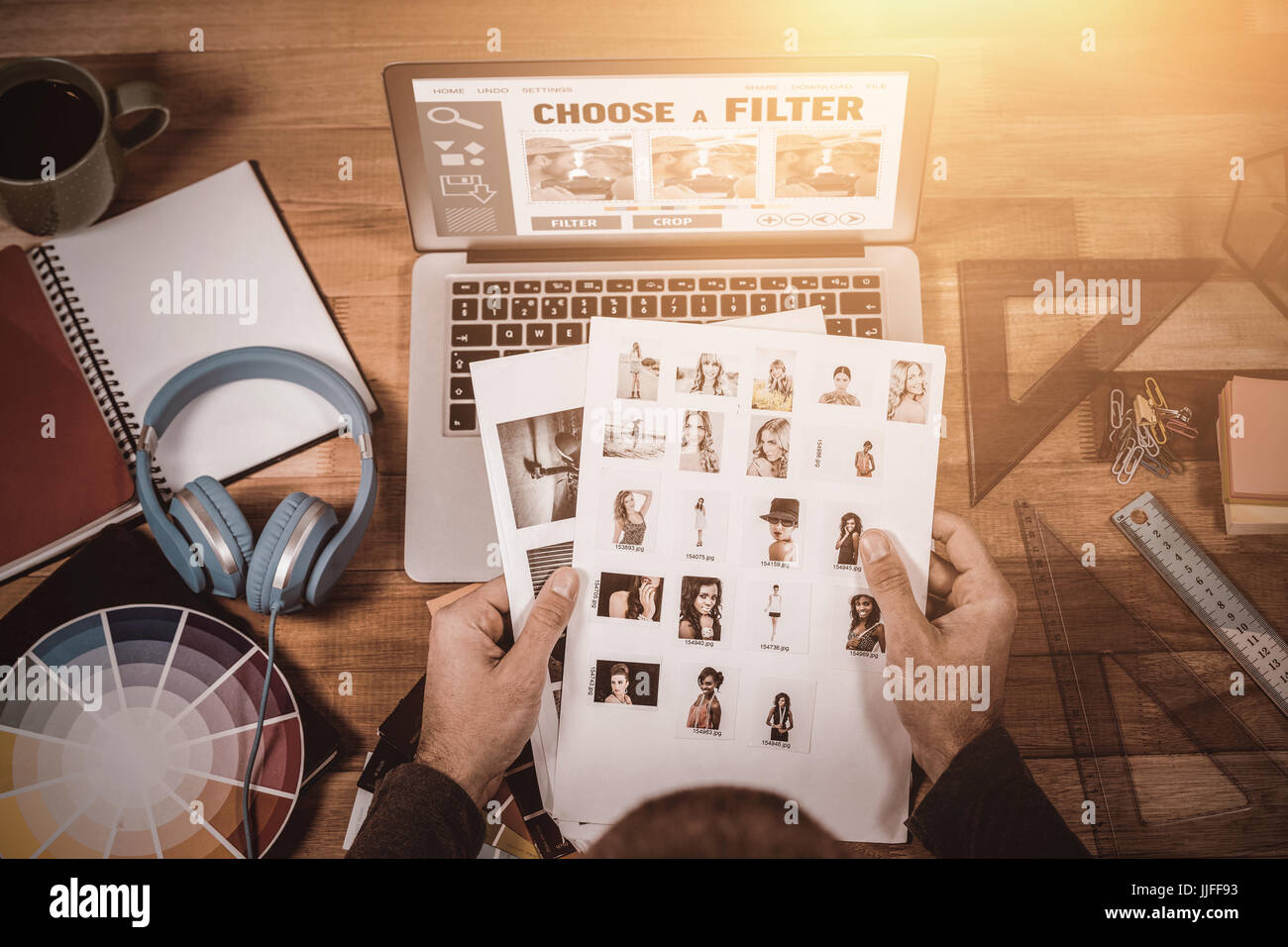 Smartphone app menu against high angle view of photographer selecting ...