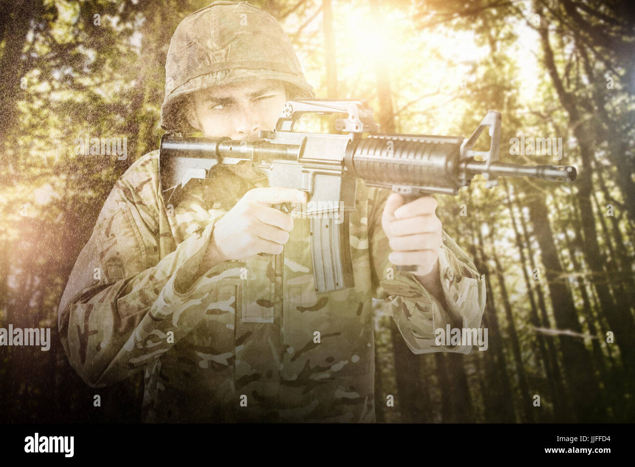 Soldier aiming with rifle against trees in a woods Stock Photo - Alamy