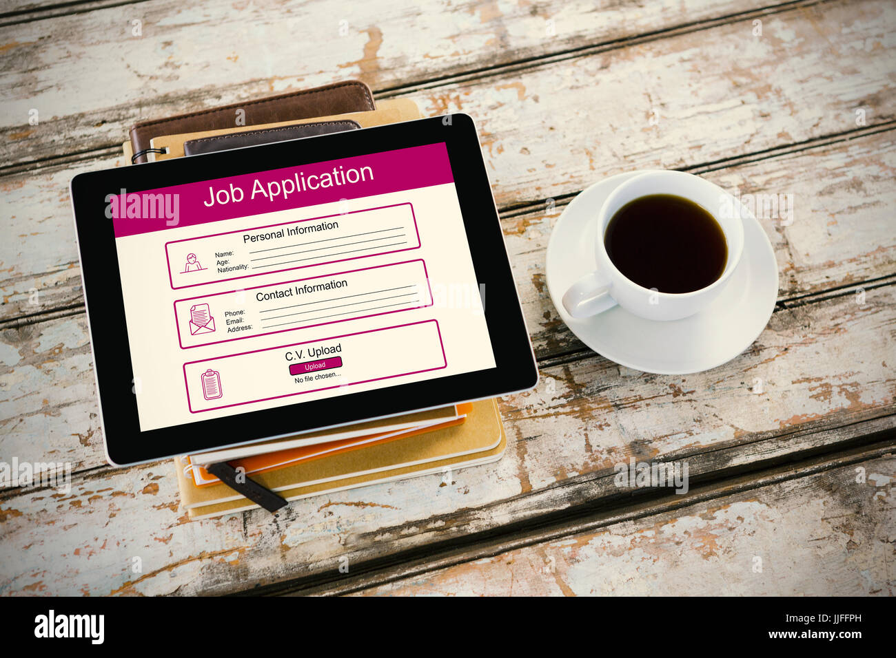 Digitally generated image of Job Application against overhead of tablet ...