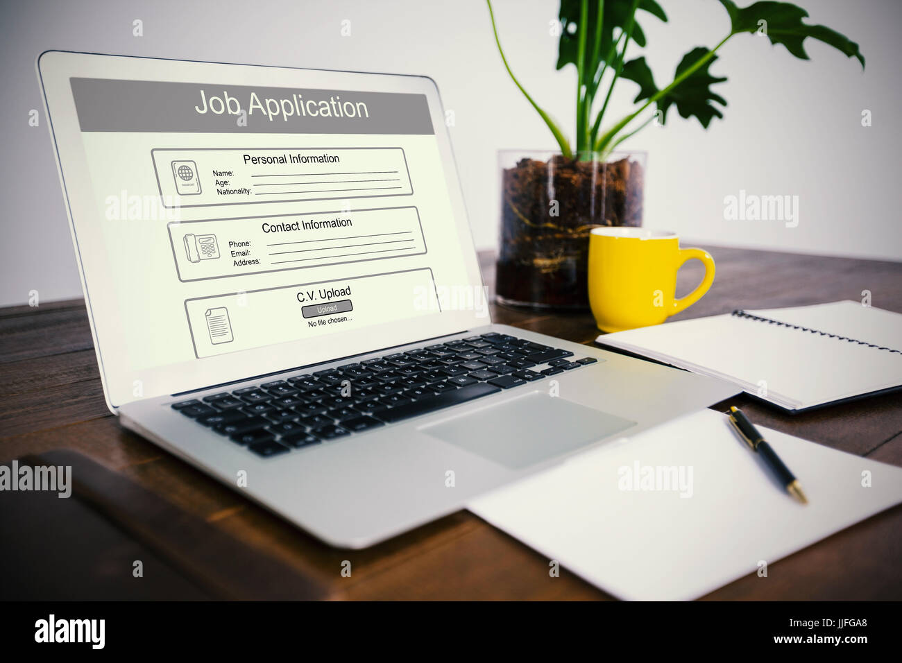 Digitally generated image of Job Application against office desk with ...