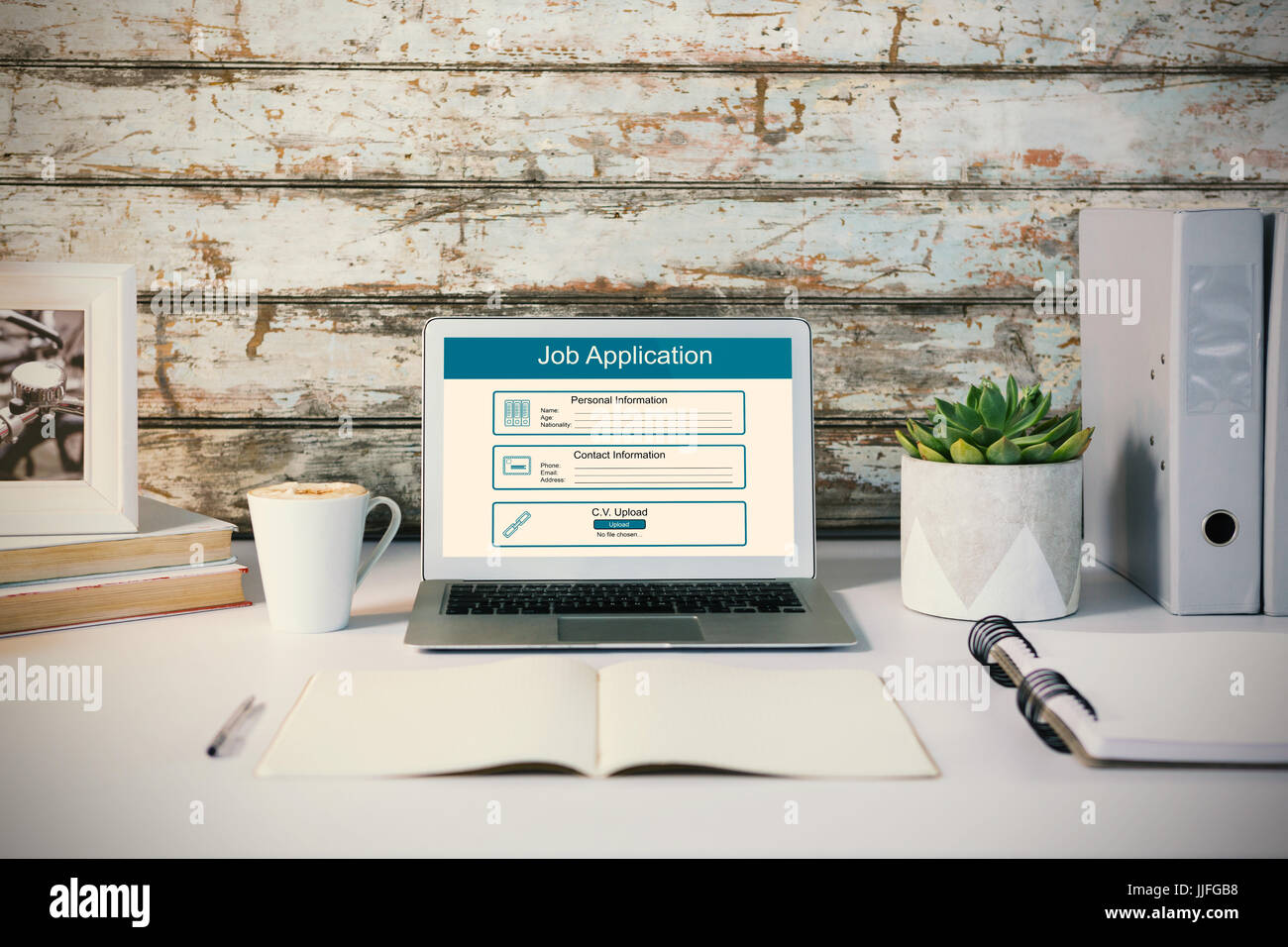 Digitally generated image of Job Application against overhead view of ...