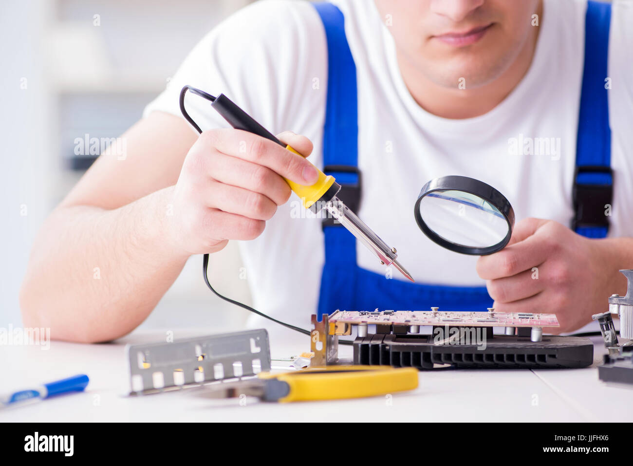 Computer repairman repairing desktop computer Stock Photo - Alamy