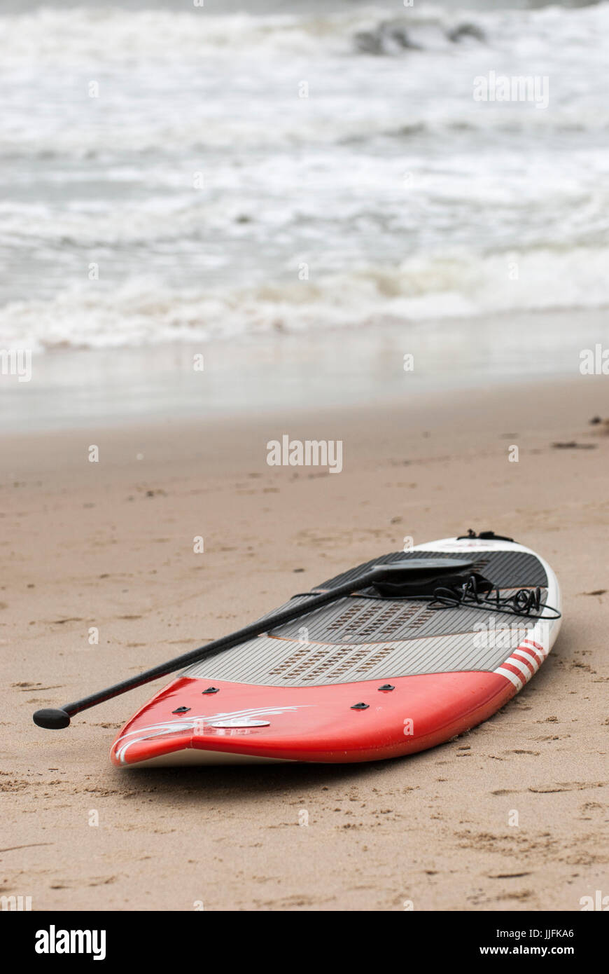 Isolation of a paddle board laying on the sands of Upper Cheung Sha ...
