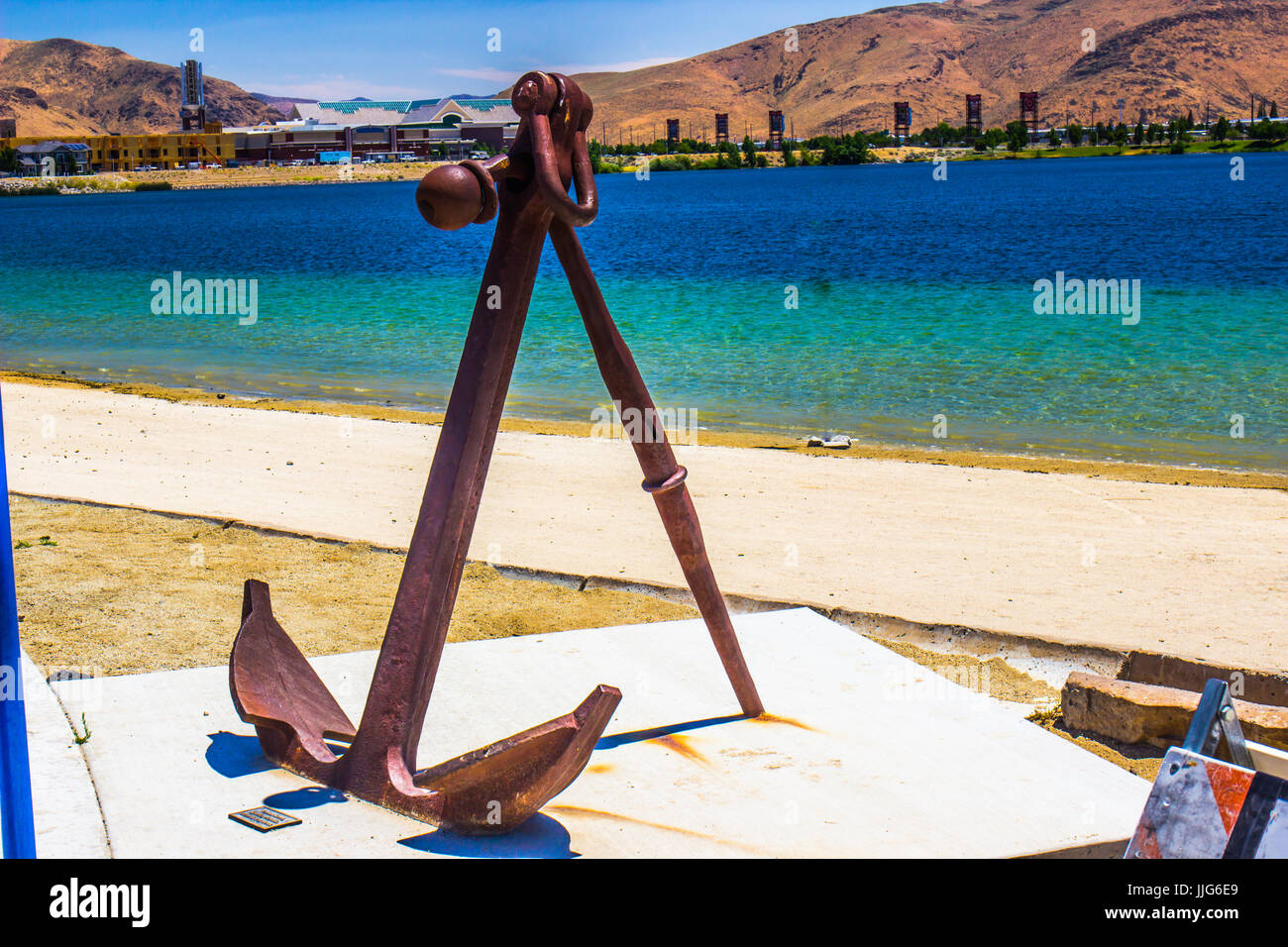 Vintage Iron Anchor On Display At Small Beach Stock Photo - Alamy