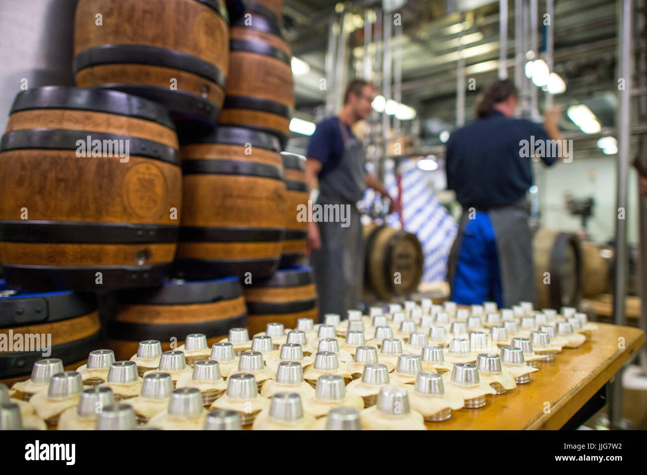 Barrels and plugs are see during the filling of wooden barrels with ...