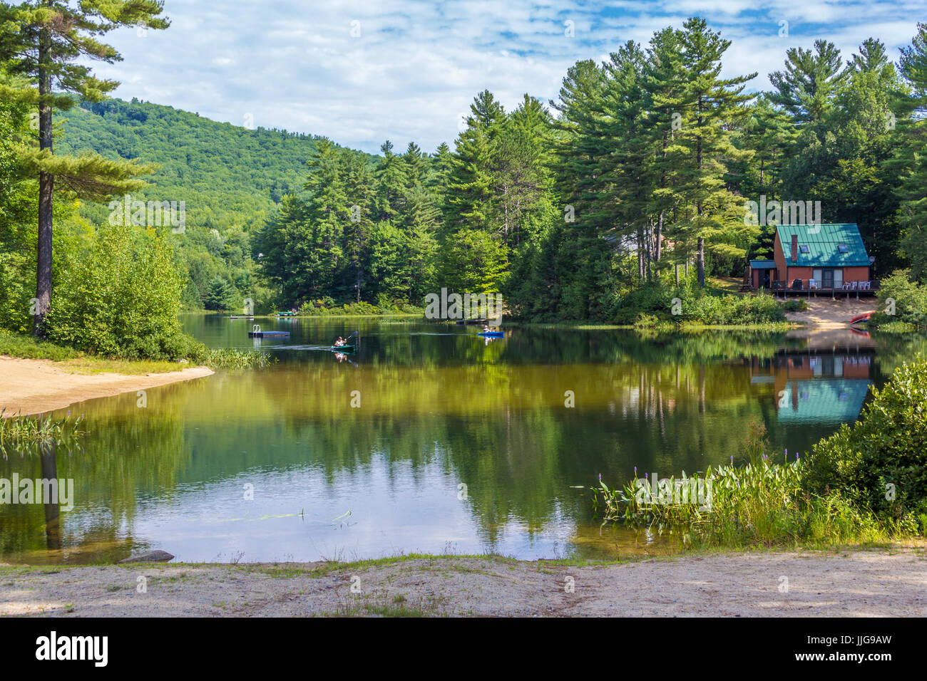 Scenic pond with mountain background where you can kayak and swim Stock ...