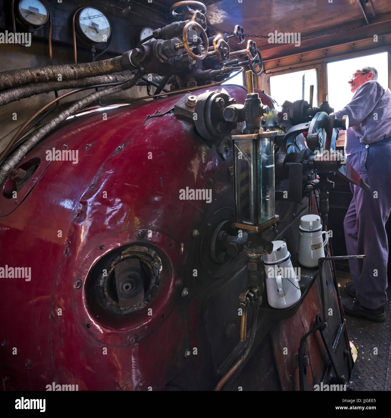 Square portrait of the driver of a steam locomotive Stock Photo - Alamy
