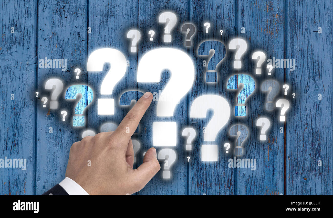 Hand pointing at question mark cloud concept Stock Photo - Alamy