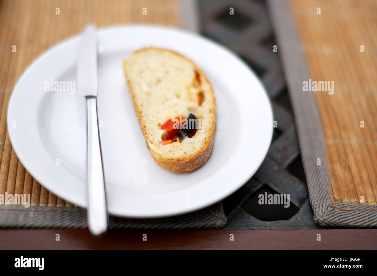 Fried white bread with olive and peppers in the restaurant Stock Photo ...