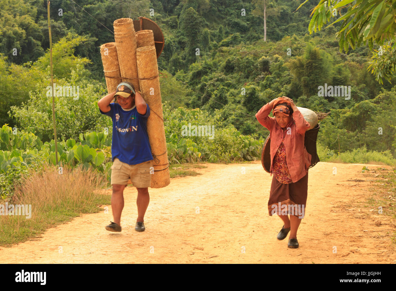 people carrying stuff on their back Stock Photo - Alamy