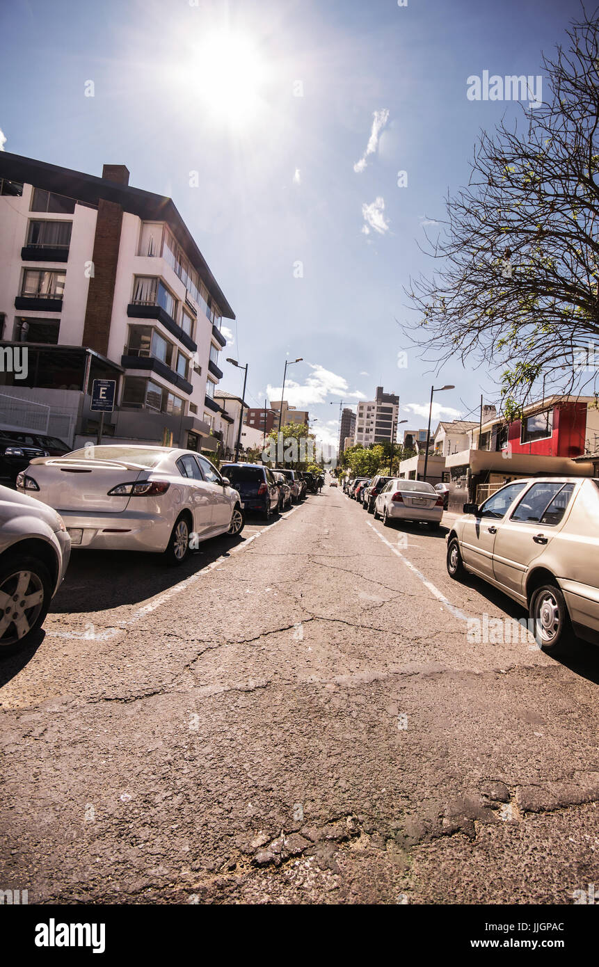Cars parked in north part of the city of Quito, Ecuador, in a sunny day ...