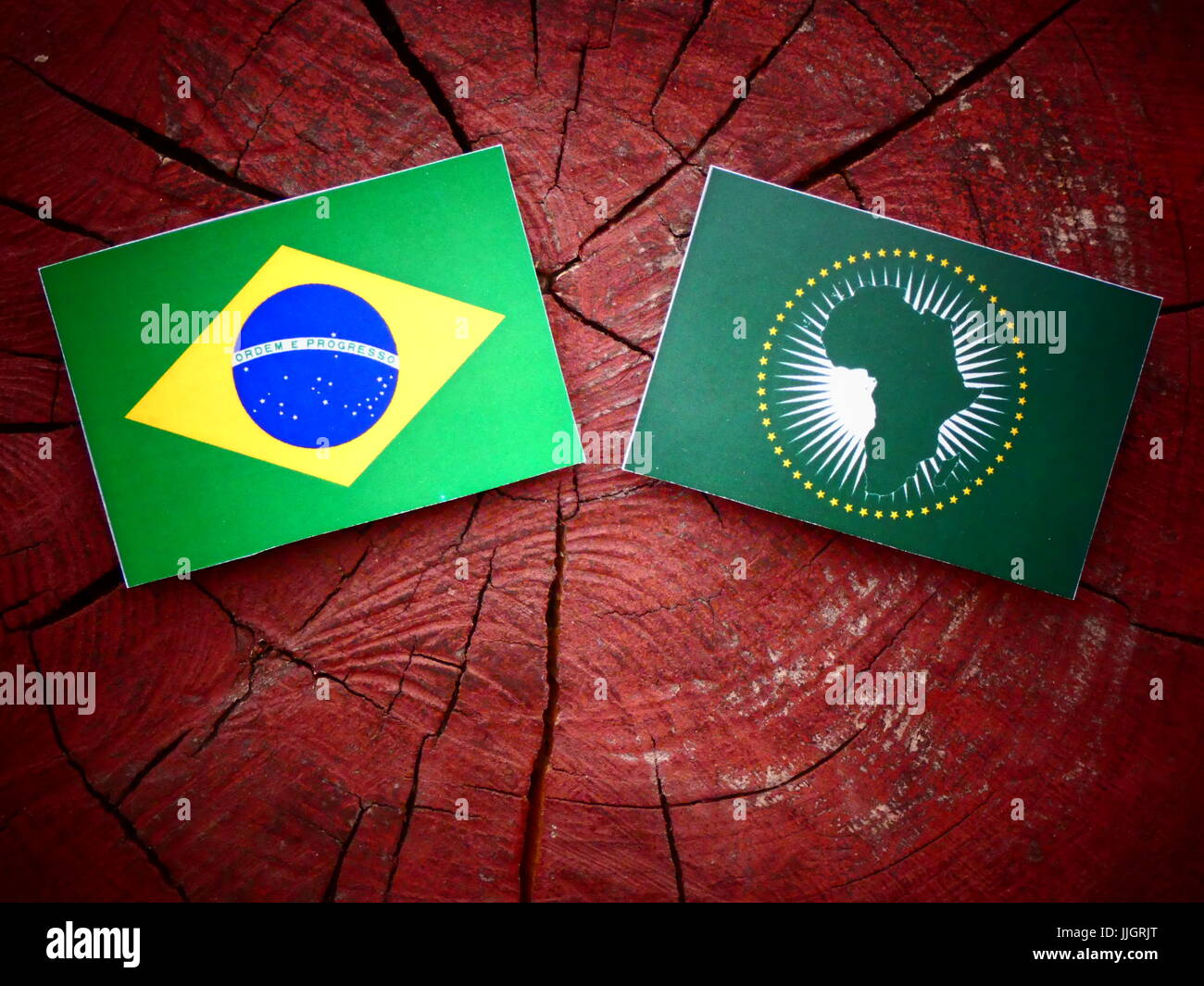 Brazilian flag with African Union flag on a tree stump isolated Stock ...