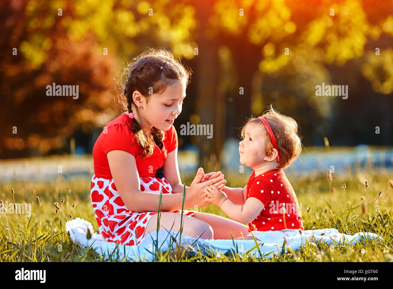 Two girls playing in summer park. Kids outdoor Stock Photo - Alamy