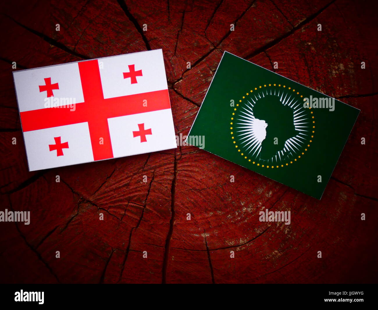 Georgian flag with African Union flag on a tree stump isolated Stock ...