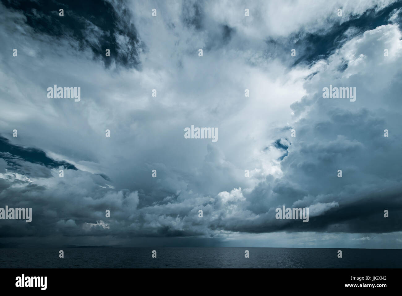 Dark clouds in open ocean Stock Photo - Alamy