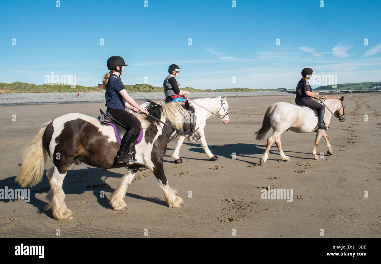 Horses being ridden on beach hi-res stock photography and images - Alamy