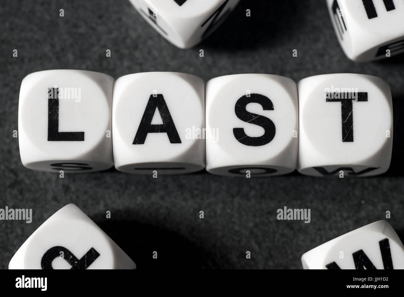 word last on white toy cubes Stock Photo - Alamy