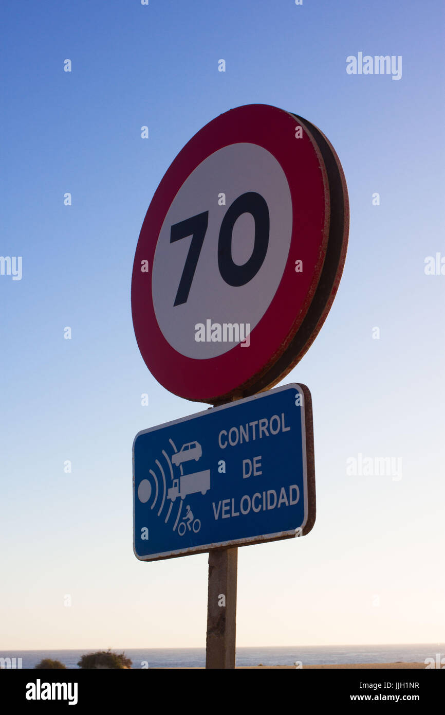 Isolated traffic sign. Seventy miles per hour speed limit sign round ...