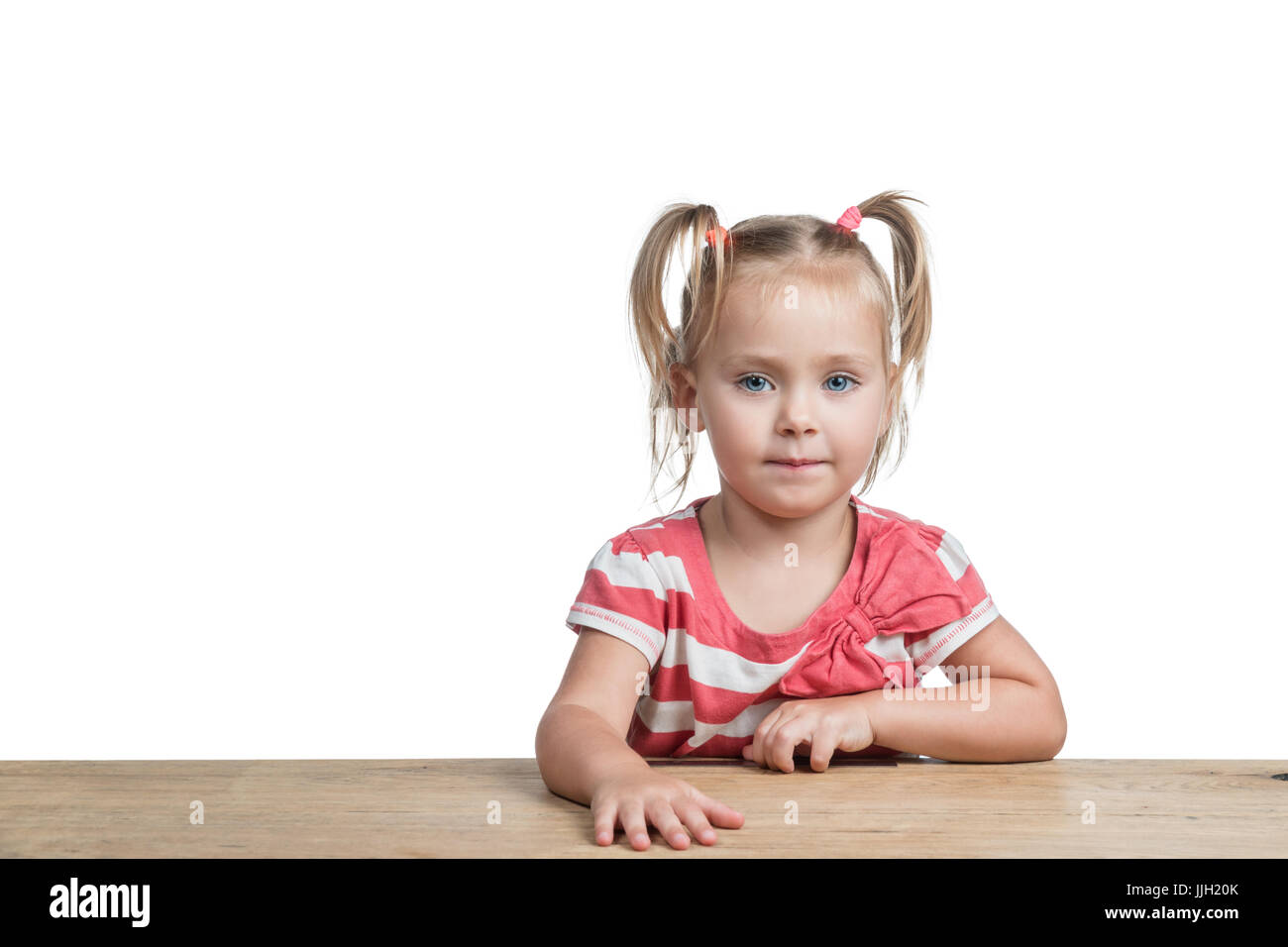 Sweet preschool girl at a desk Stock Photo - Alamy