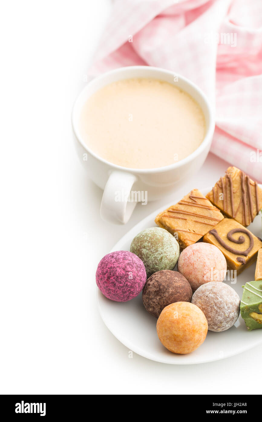 Various sweet candies and coffee cup with coffee Stock Photo - Alamy
