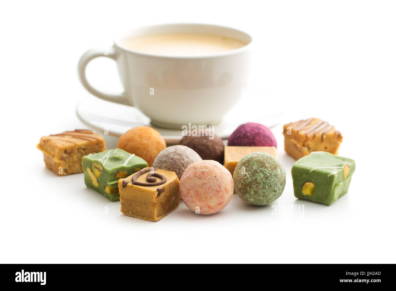 Various sweet candies and coffee cup with coffee Stock Photo - Alamy