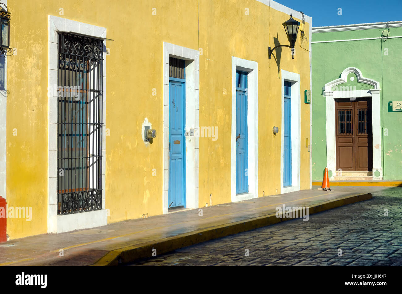 Colorful corner between two colonial houses in the street in Campeche ...