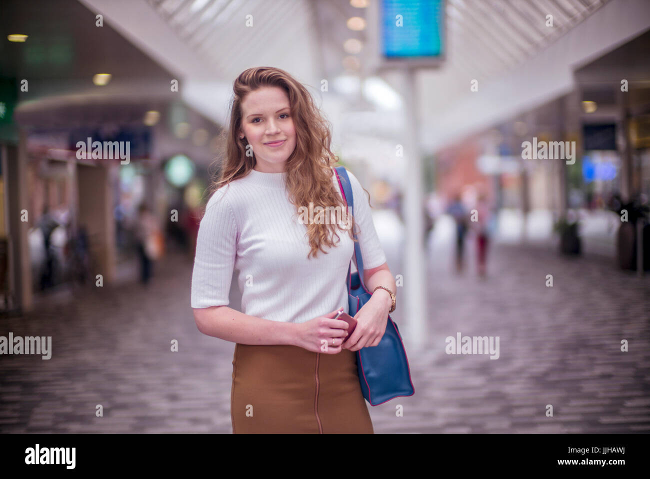 A young woman out shopping for the day Stock Photo - Alamy