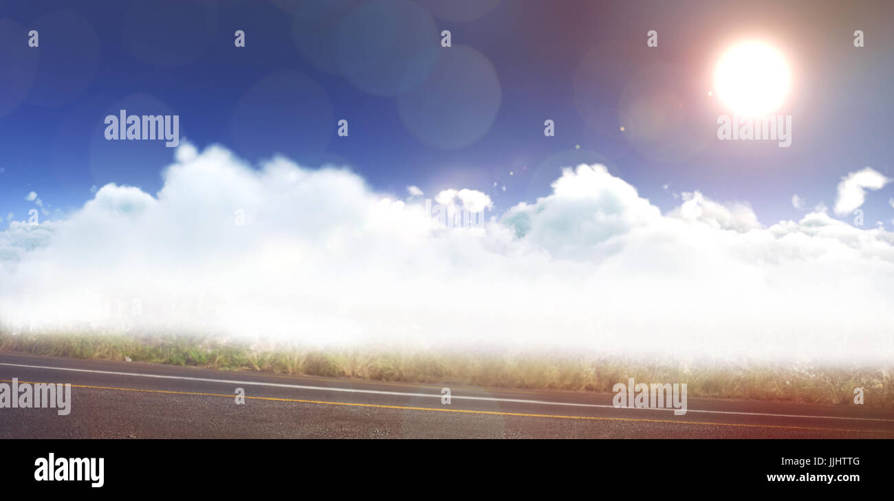 Idyllic view of sun over clouds during sunny day against view of ...