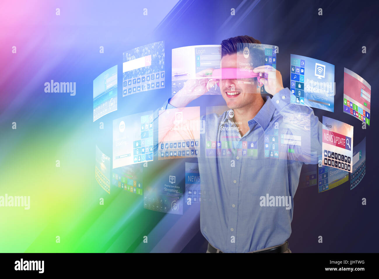 Happy young man using virtual video glasses against modern table in ...